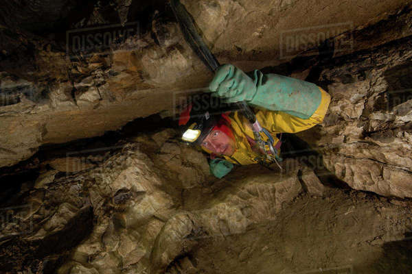 Known as a 'letter-box squeeze' in Veryovkina cave, the main way down ...