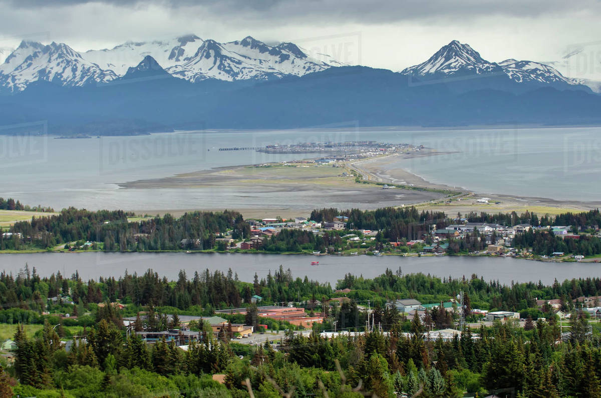 A float plane taxis and takes off from Beluga Lake in Homer, Alaska ...