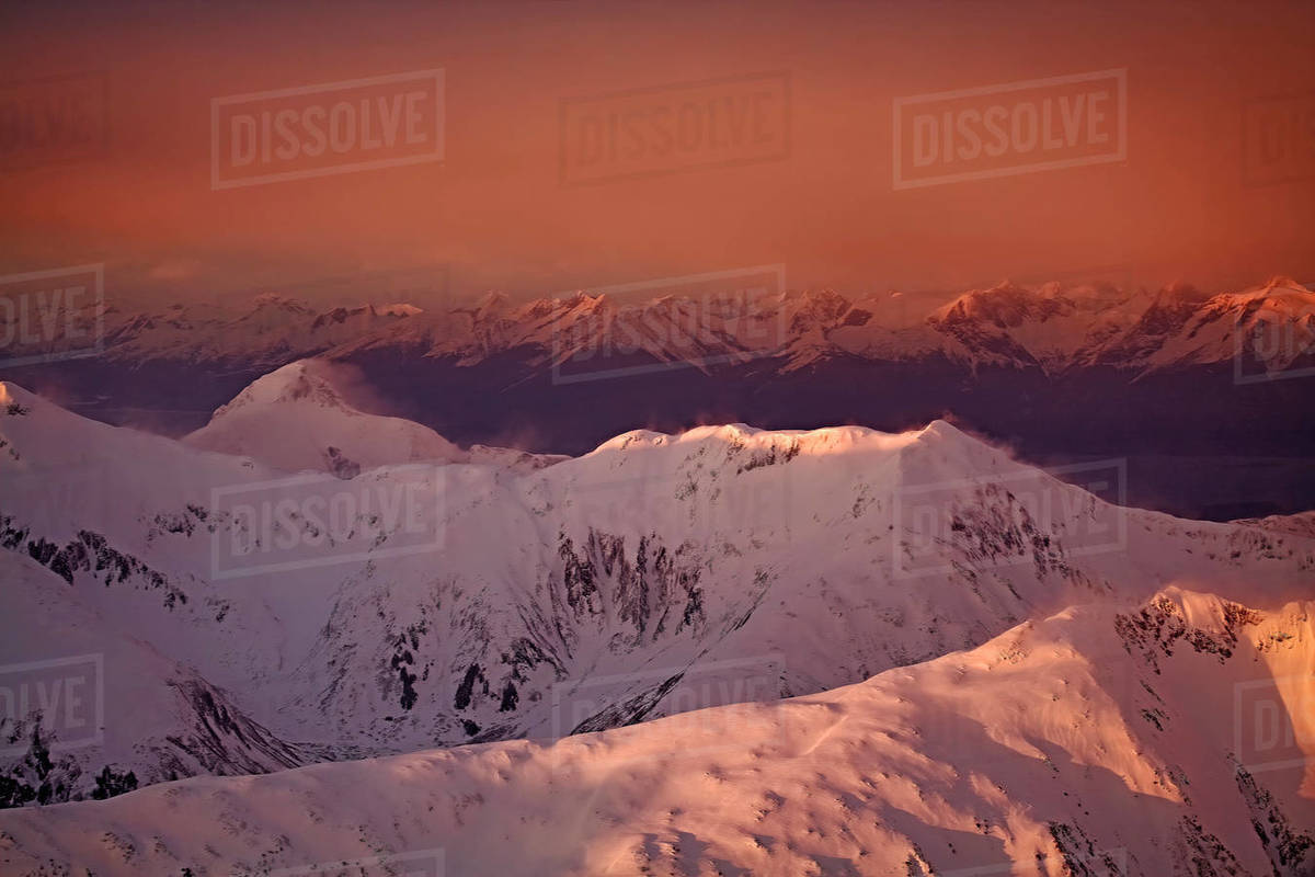 Harsh winds blow snow across the craggy ridges and peaks of the South ...