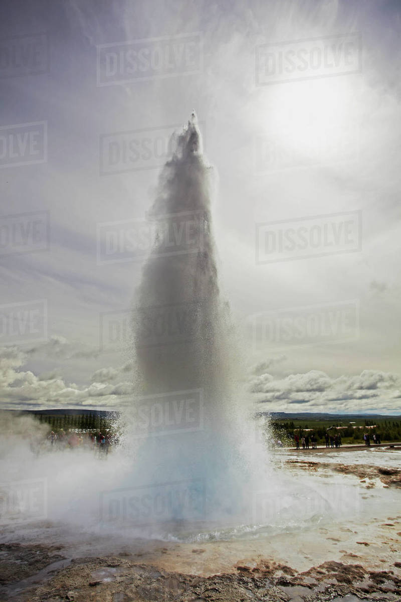 The Strokkur geysir erupts, Geysir, in the Golden Circle, Iceland.; At ...