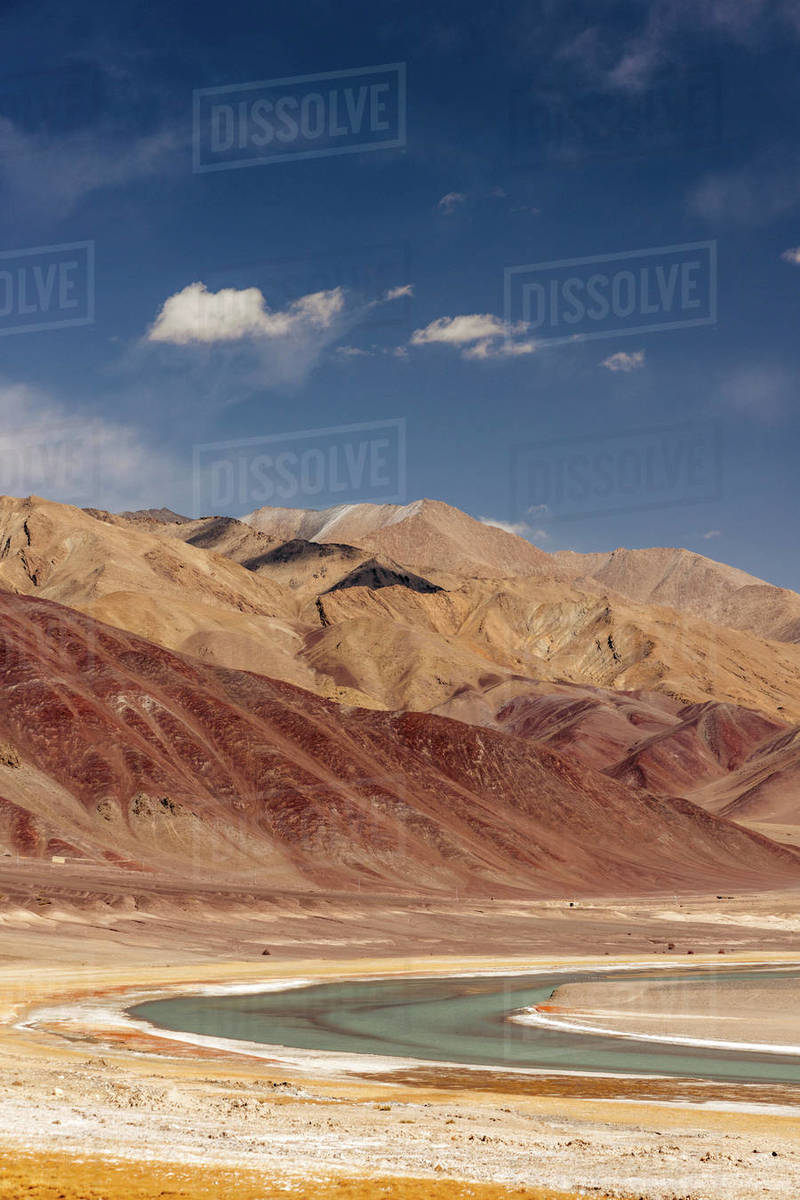 Indus River running through the valley surrounded by mountains in ...