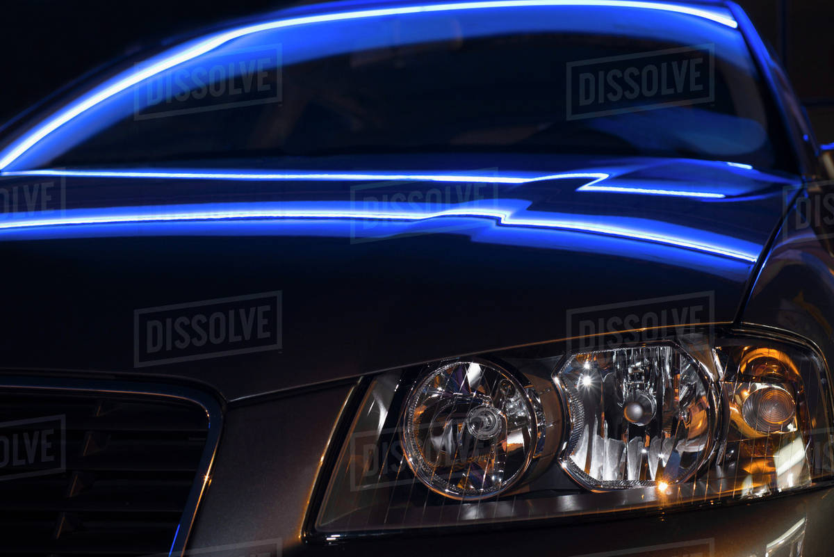 Light reflects on the hood and windshield of a brand new car; Ascona ...