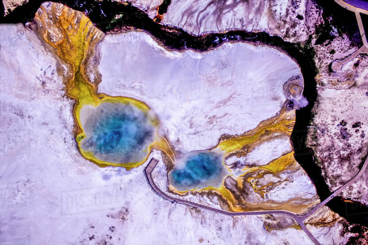 Dramatic aerial view of blue hot springs in Black Sand Basin of ...