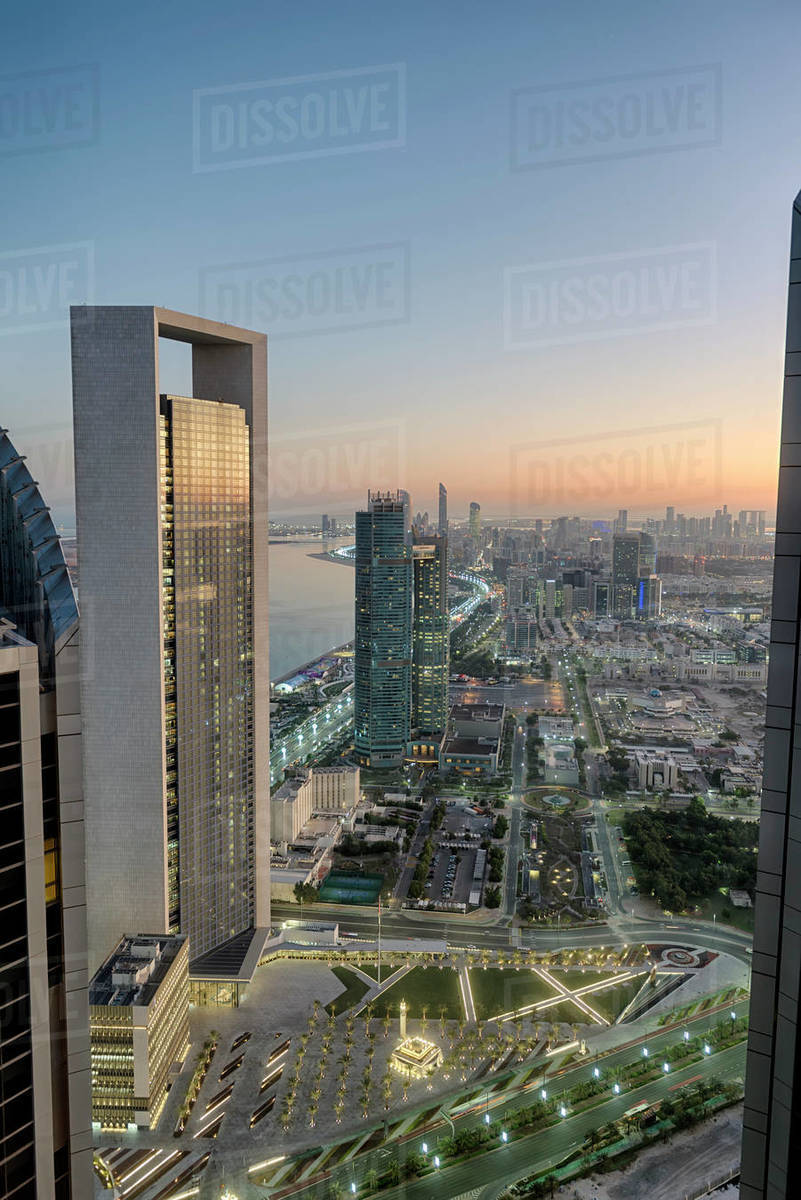 ADNOC Headquarters building, a skyscraper at dusk; Abu Dhabi, United ...
