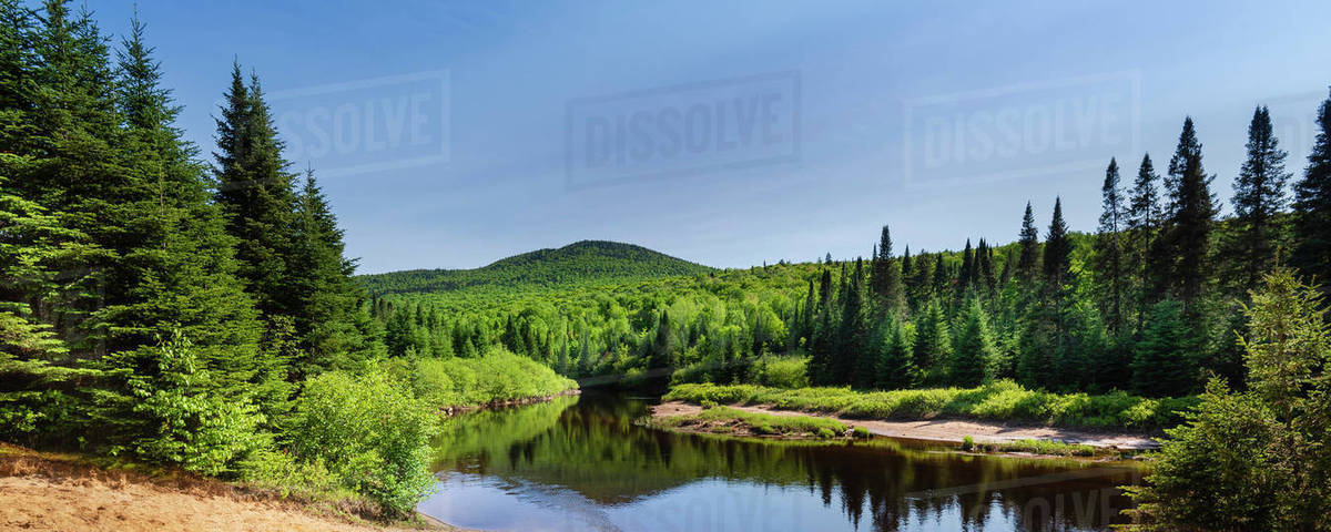 Tranquil lake and lush forests in Mont-Tremblant National Park of the ...