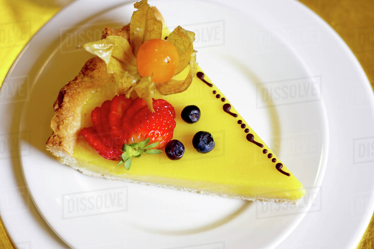 Piece Of Lemon Fruit Flan Dessert On White Plate - Royalty-free Stock ...