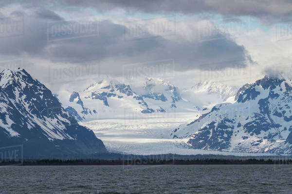 A view of sheridan glacier and the chugach mountains with blue sky and ...
