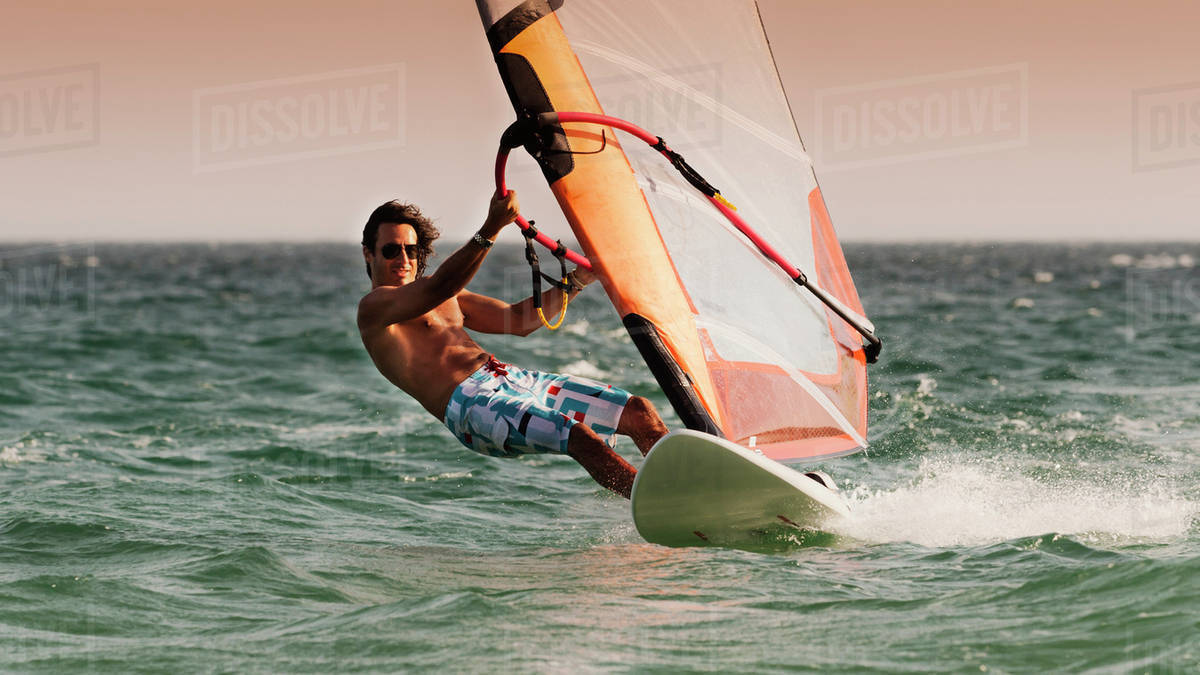 A Man Windsurfing; Tarifa, Cadiz, Andalusia, Spain - Royalty-free Stock ...