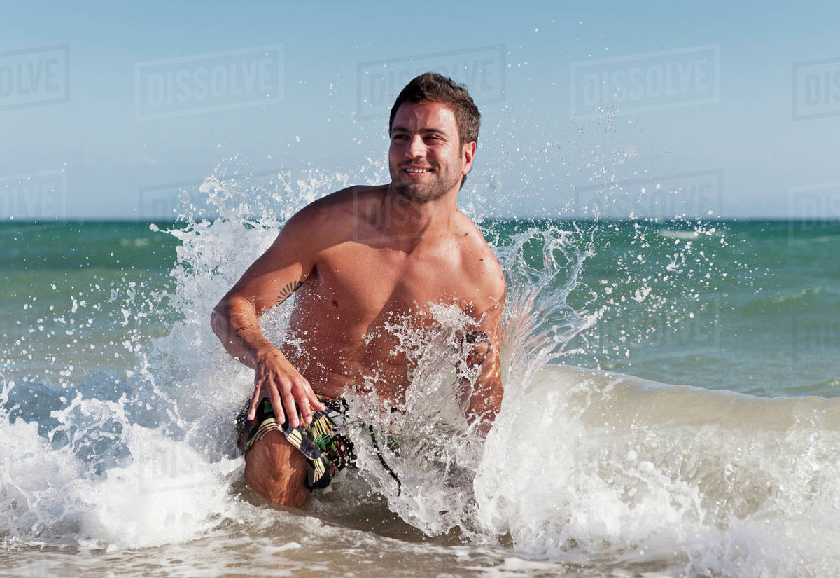 A Man Splashing In The Water; Tarifa, Cadiz, Andalusia, Spain - Royalty ...