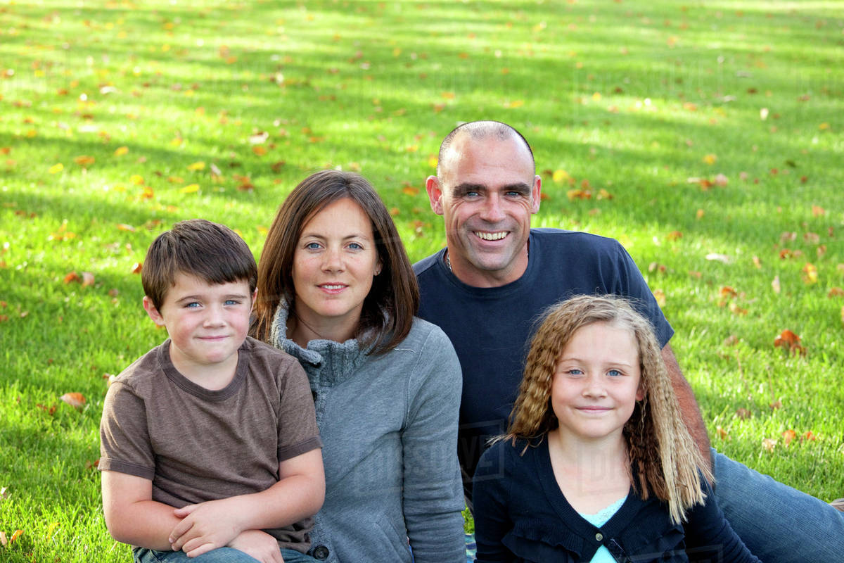 Family Portrait In A Park; Beaumont, Alberta, Canada - Royalty-free ...