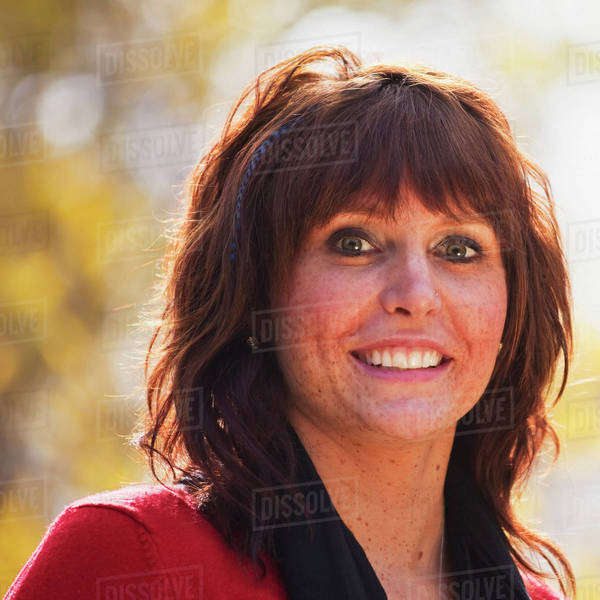 Portrait Of A Young Woman In A Park In Autumn; Edmonton, Alberta ...