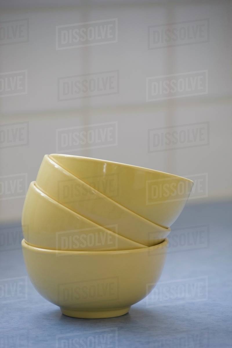 A Stack Of Yellow Bowls - Royalty-free Stock Photo | Dissolve