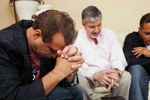 Men Praying Together - Royalty-free Stock Photo | Dissolve