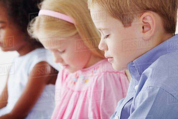 Children With Eyes Closed In Prayer - Royalty-free Stock Photo | Dissolve