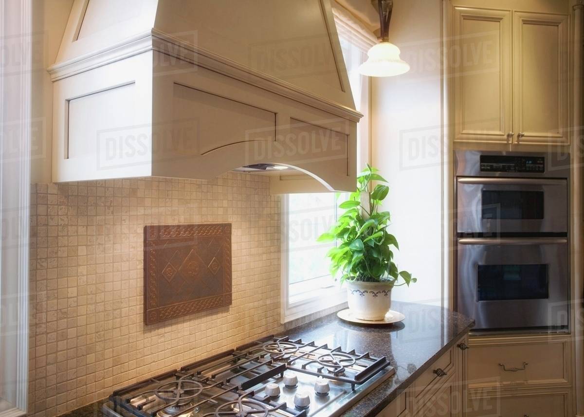 Hood Over A Cook Top Stove In A Kitchen - Stock Photo - Dissolve