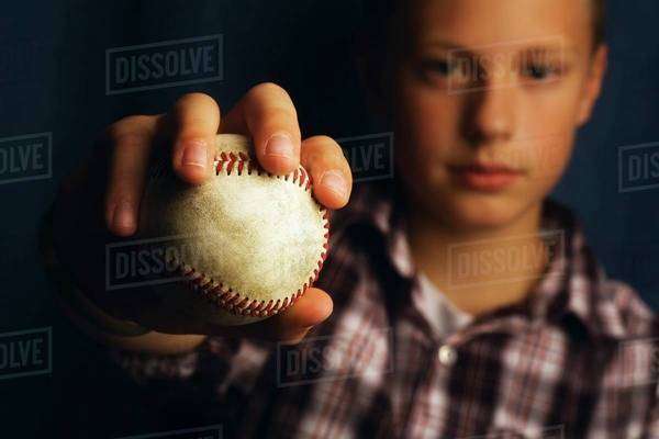 A Boy Holding A Baseball - Royalty-free Stock Photo | Dissolve
