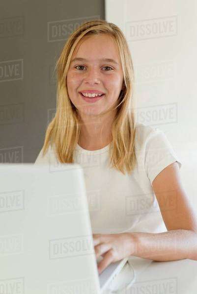 A Girl Wearing White And Using A White Laptop Computer; Benalamadena ...