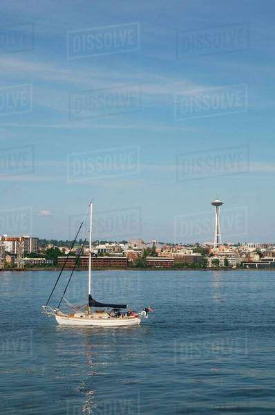Seattle Skyline And A Sailboat In The Water; Seattle, Washington ...