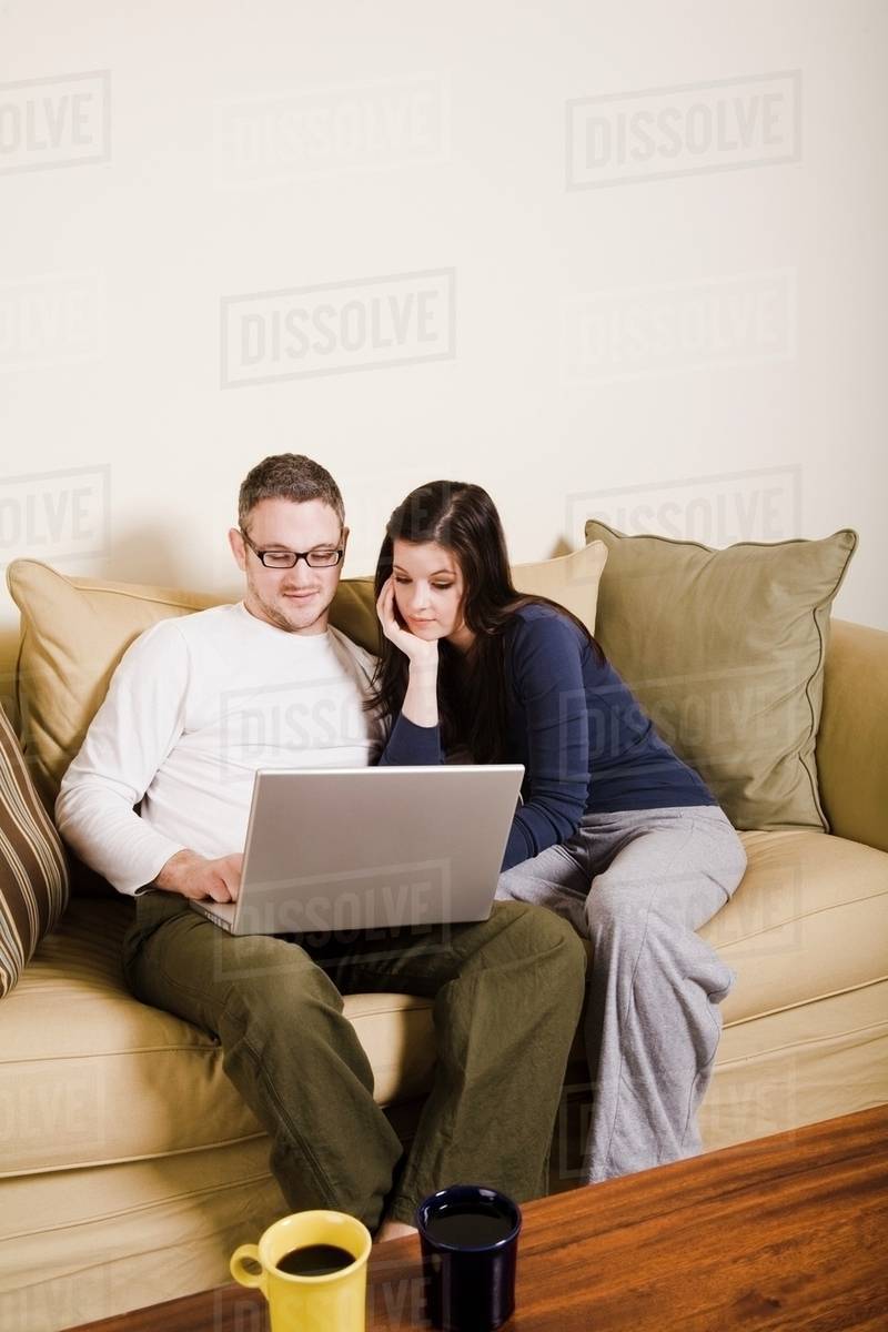 Couple Looking At Computer - Stock Photo - Dissolve