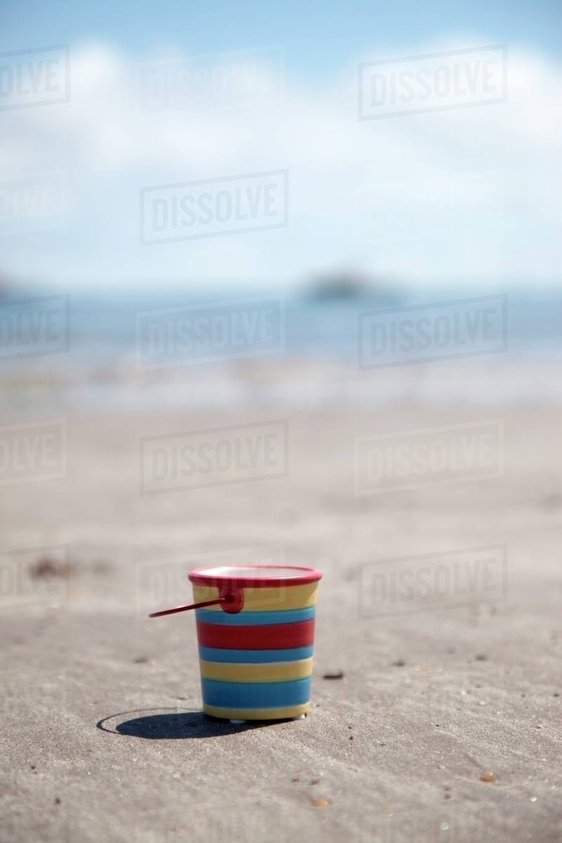 Sand Bucket On Beach; Boulmer Beach, Northumberland, England - Royalty ...