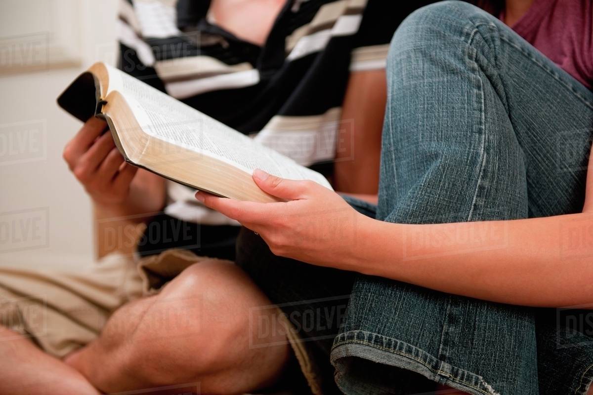 A Couple Reading The Bible Together - Stock Photo - Dissolve