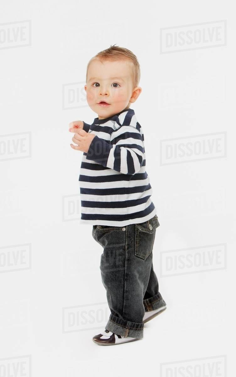Male Toddler Standing Against White Background - Royalty-free Stock ...