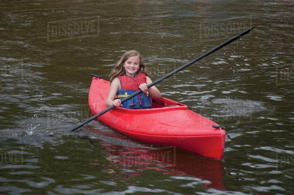Girl In A Kayak - Royalty-free Stock Photo | Dissolve