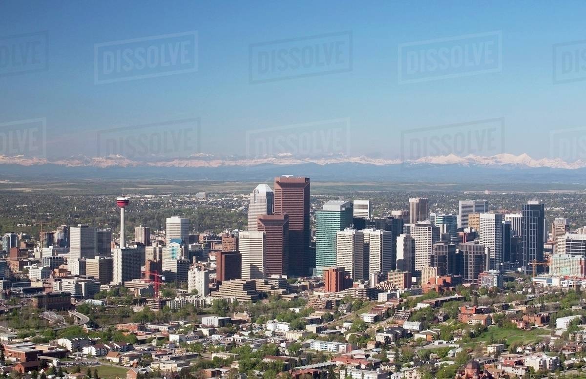 Calgary, Alberta, Canada; Calgary Skyline With Mountains In The ...