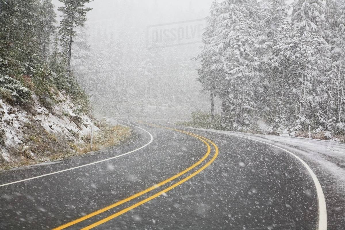 Road During A Snowfall - Royalty-free Stock Photo | Dissolve