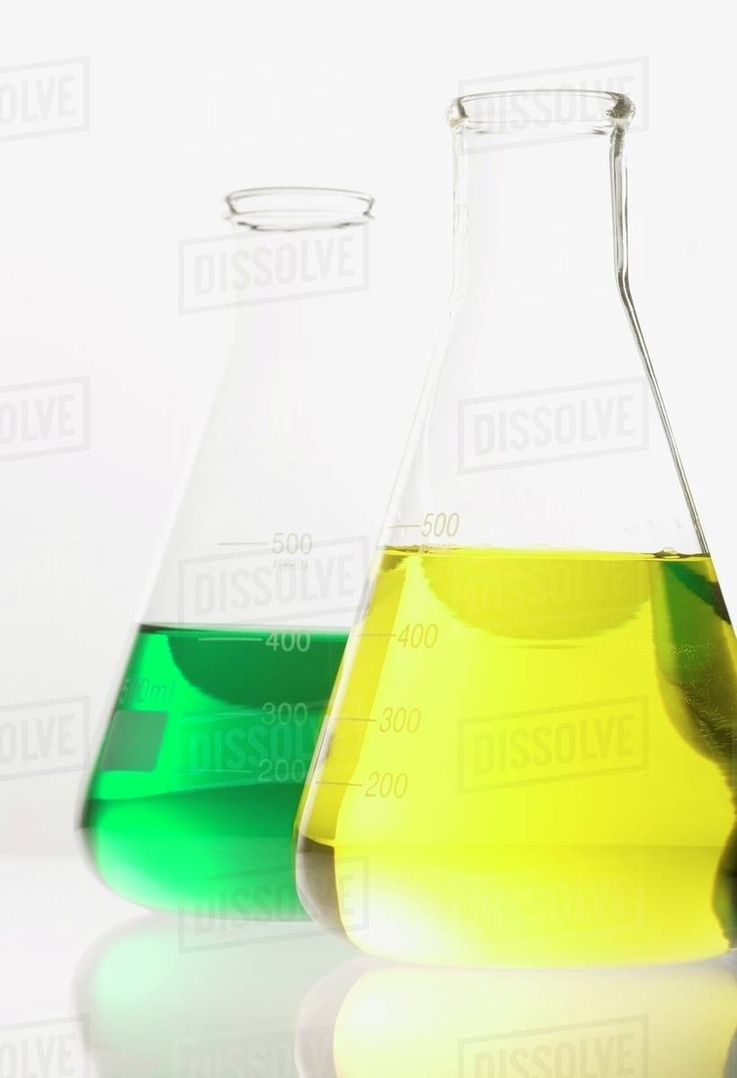 Two Glass Flasks With Colored Solutions - Stock Photo - Dissolve
