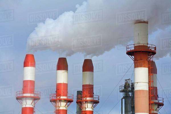 Oil Refinery Chimneys - Stock Photo - Dissolve