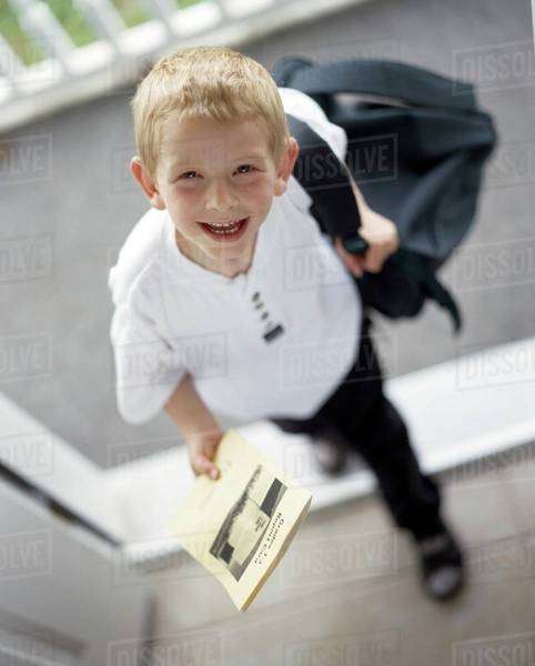 Boy Coming Home From School - Royalty-free Stock Photo | Dissolve