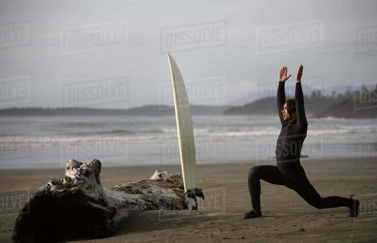 Surfer Stretching On Beach, Cox Bay Near Tofino, British Columbia ...