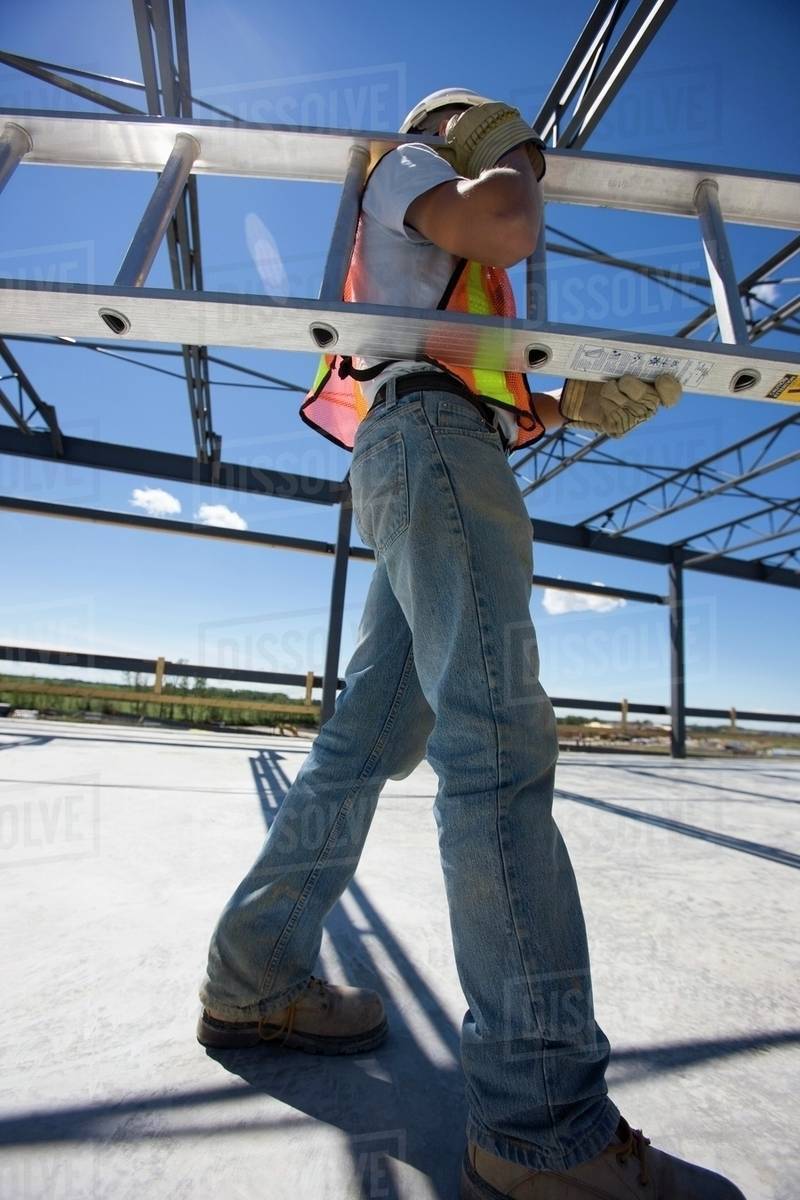 Construction Worker Carrying A Ladder - Royalty-free Stock Photo | Dissolve