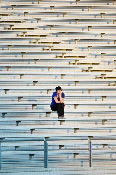 Person On Bleachers - Royalty-free Stock Photo | Dissolve