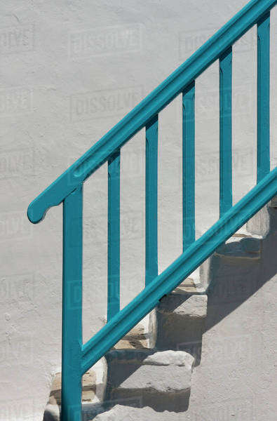 A blue railing on white painted stone stairs; Mykonos Town, Mykonos ...