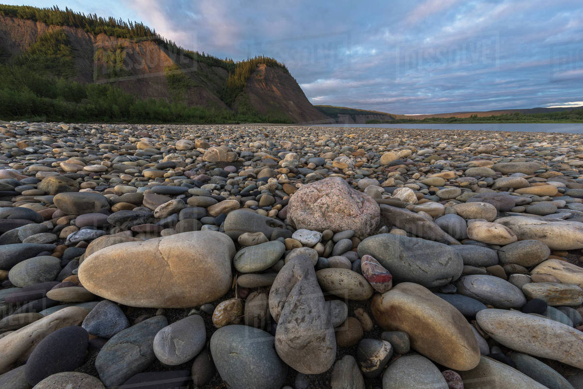 The rocky shoreline along the Peel River, near Taco Bar; Yukon, Canada ...