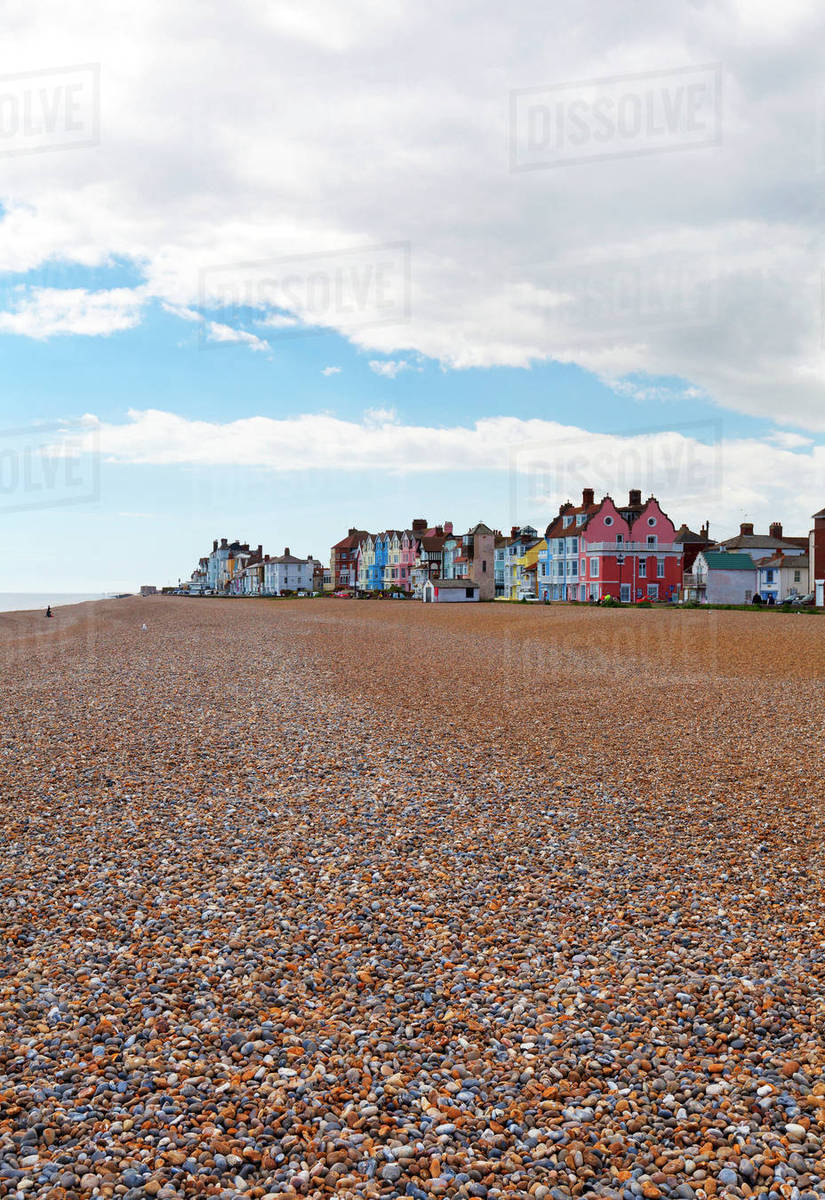 Empty Beach With Colourful Resort Houses In The Distance; Aldeburgh ...