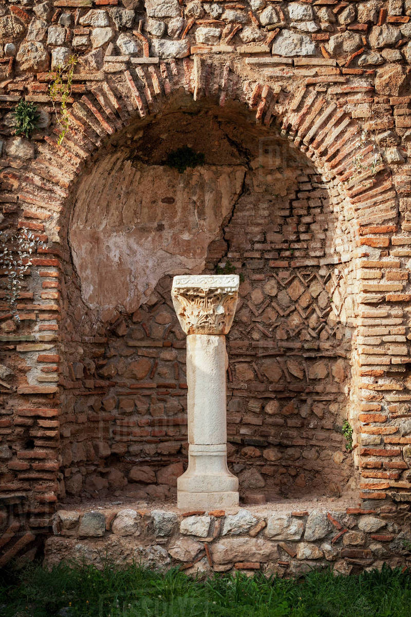 Niche In A Stone Wall With Column And Capitol; Delphi, Greece - Royalty ...