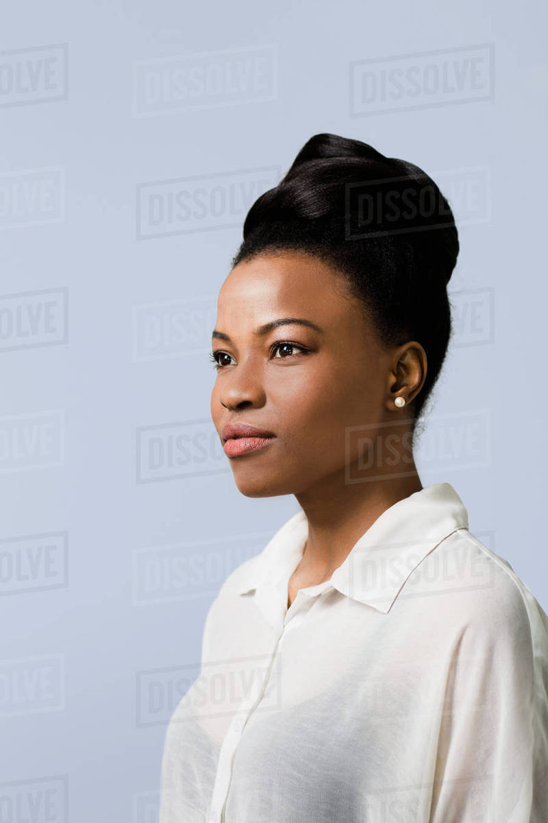 Close Up Portrait Of An African Canadian Woman Against Blue Wall ...