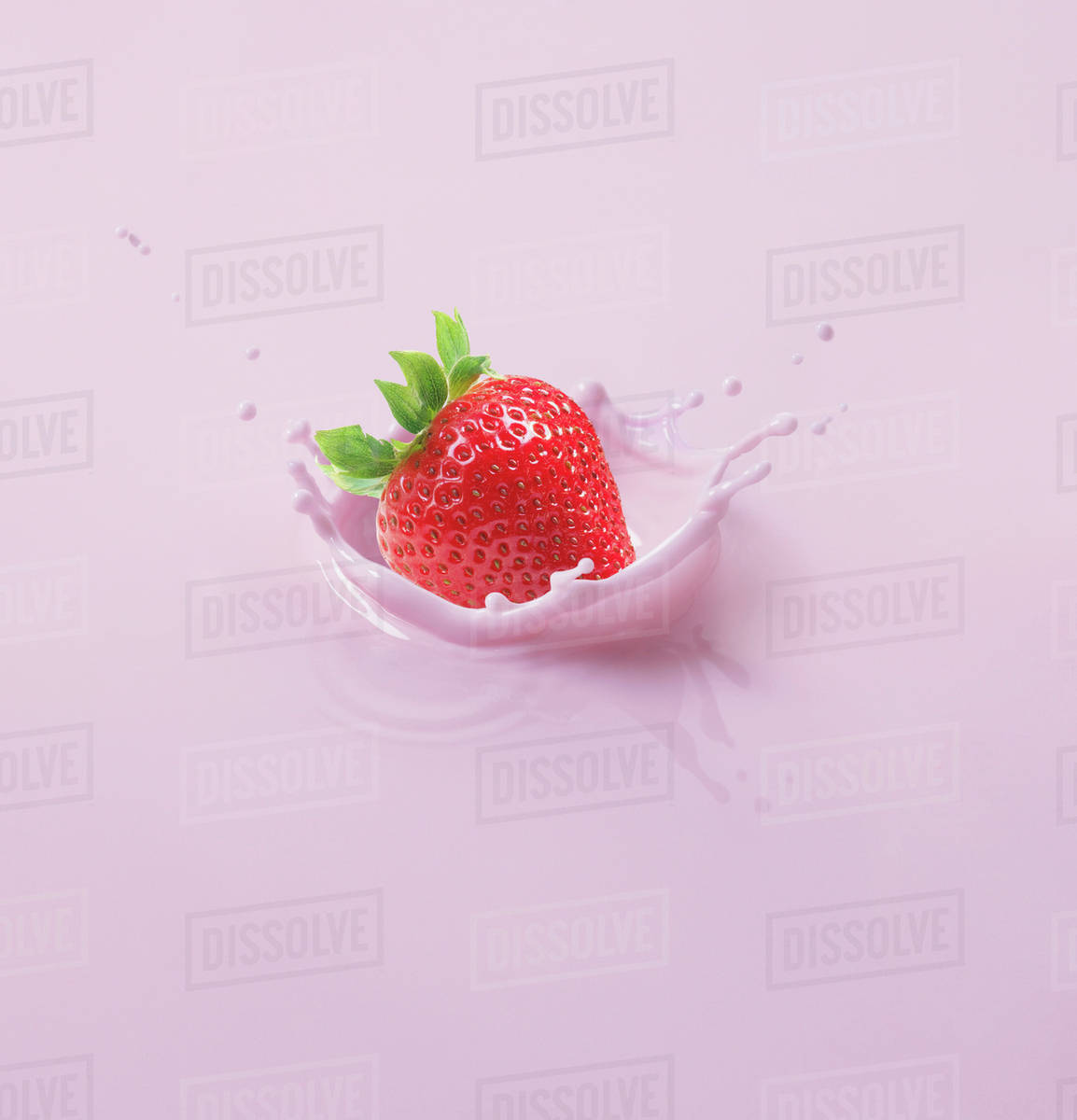 A strawberry splashing into pink liquid - Royalty-free Stock Photo ...