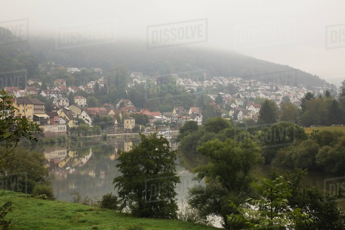 Neckar river and residential homes in Meinbach village through morning ...