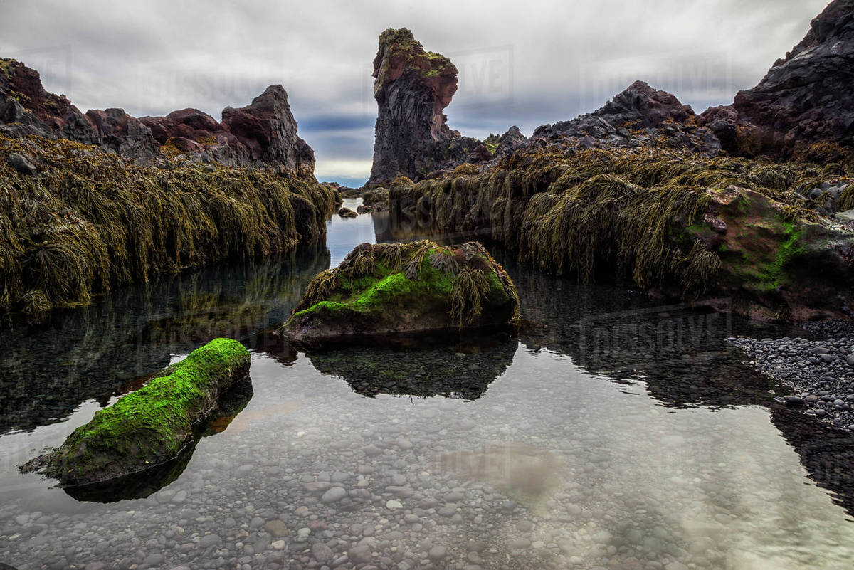 Tidal Pool On The Beach Called Djupalonsanndur On The Western Coast Of ...