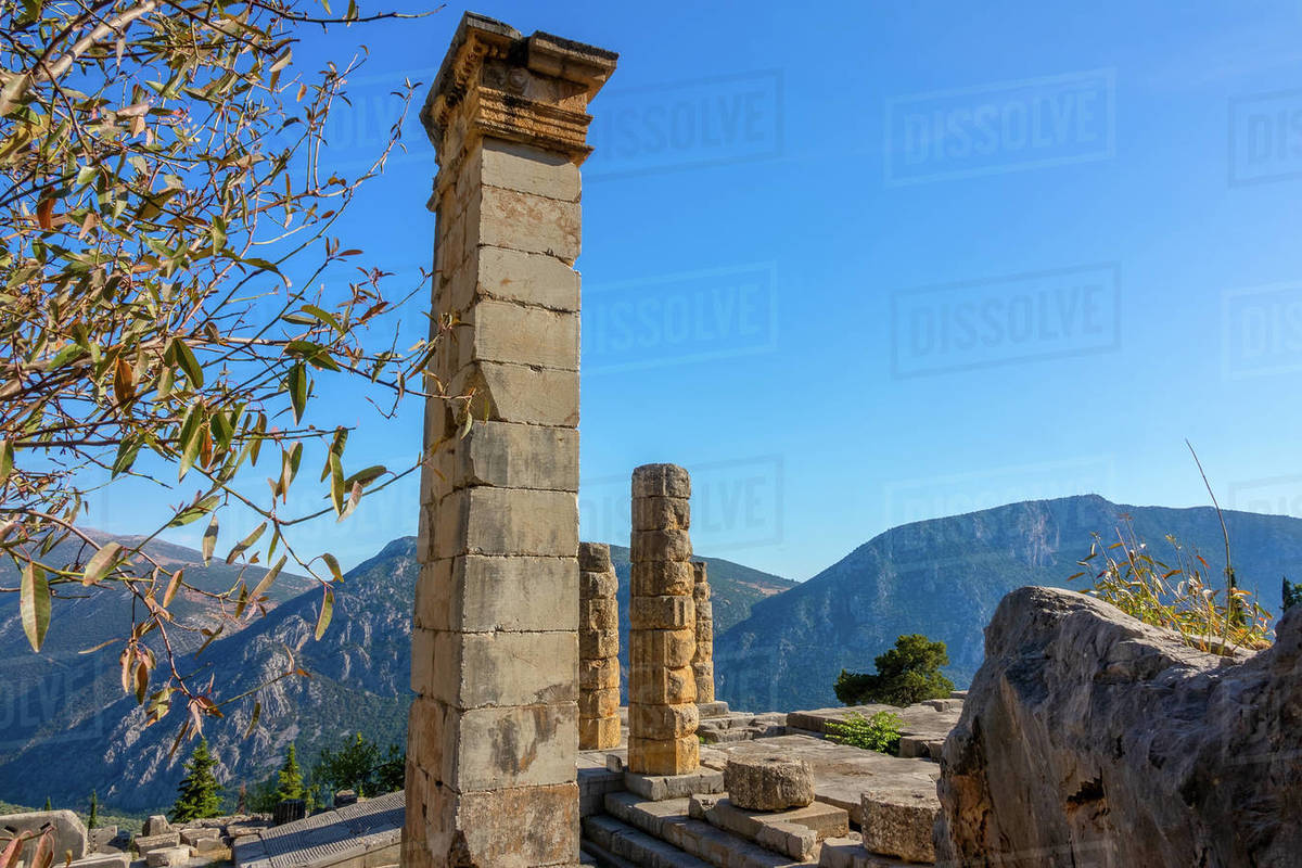 Greece. Delphi. Ancient ruins in the sunny mountains and blue sky ...