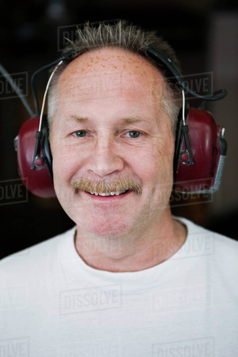 Portrait of carpenter wearing ear protectors - Royalty-free Stock Photo ...