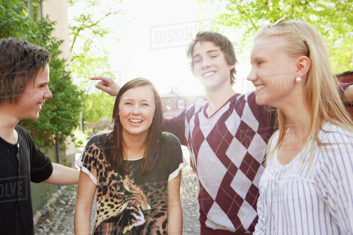 Cheerful friends enjoying together - Stock Photo - Dissolve