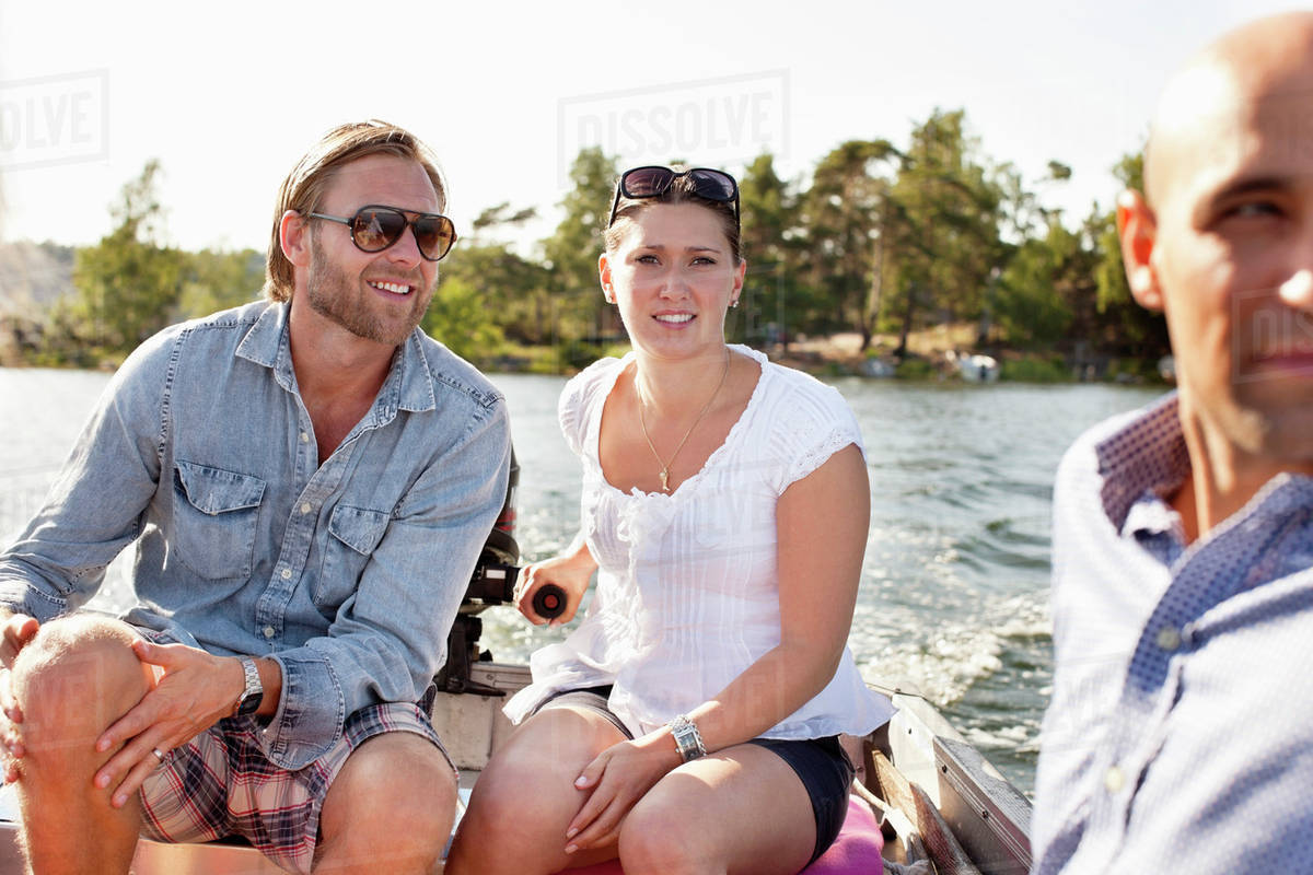 Three friends sailing together on the boat - Stock Photo - Dissolve