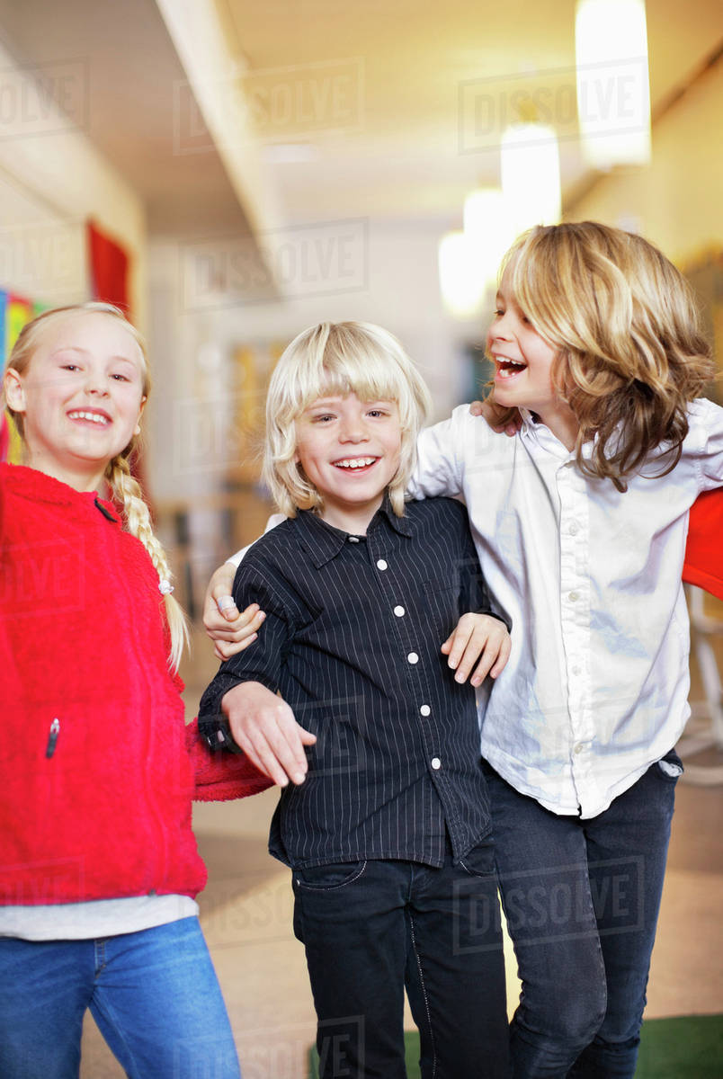 Portrait of three friends laughing together - Royalty-free Stock Photo ...