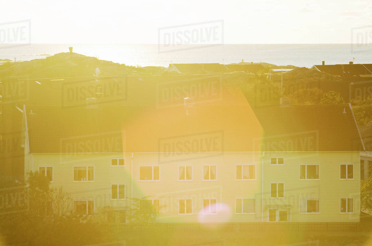 Facade of residential building with horizon in background at sunset ...