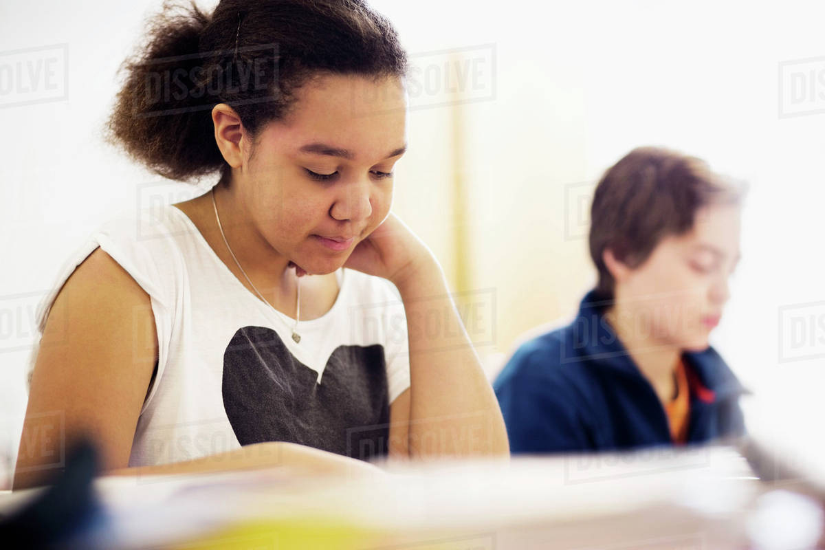 High school girl studying in class - Royalty-free Stock Photo | Dissolve